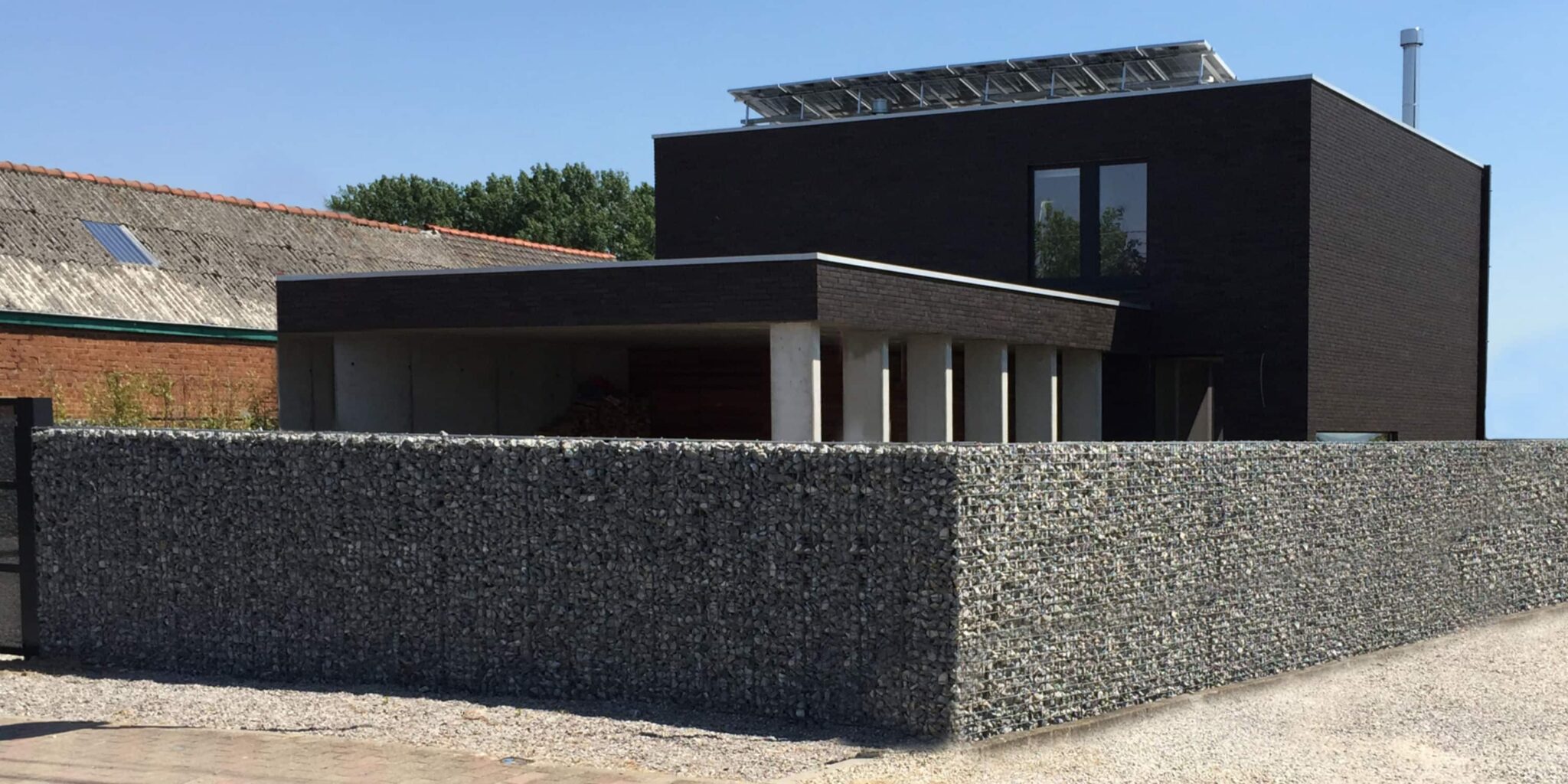 Clôture en pierre : Possibilités et prix [+ alternatives]